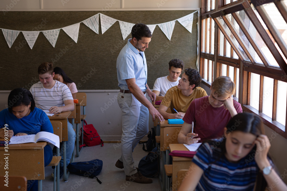 Students studying in classroom Stock Photo | Adobe Stock