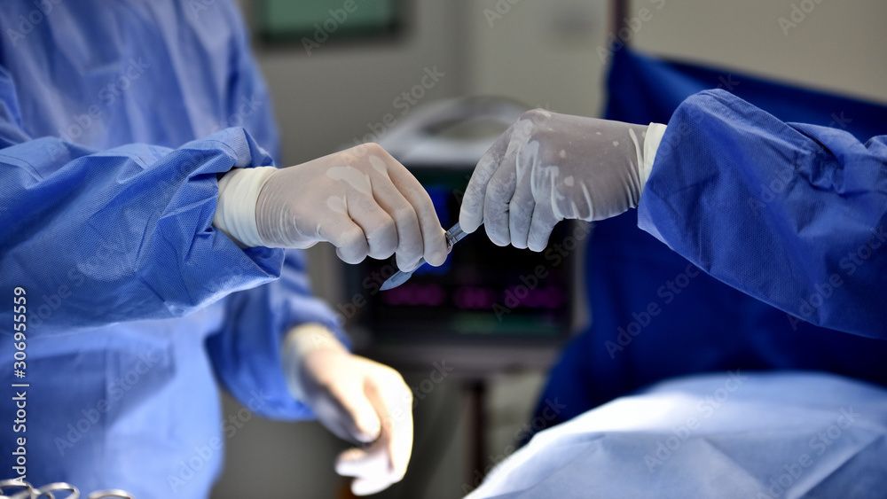 Medical Team Performing Surgical Operation in Modern Operating Room ...