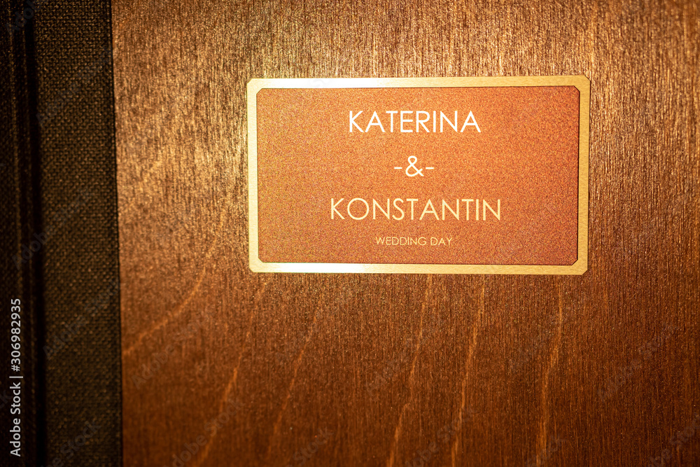 personalized photobook in a wooden cover with a metal nameplate. new ...