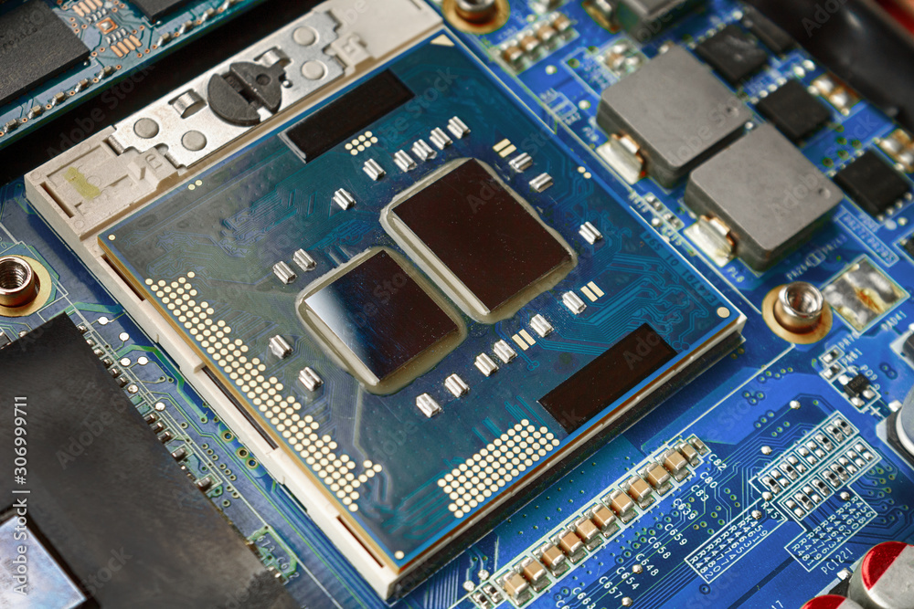 computer CPU close-up on the motherboard background, socket of central process unit, connection ...