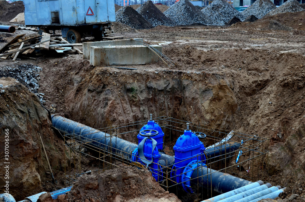 Laying underground storm sewers at a construction site. Groundwater ...