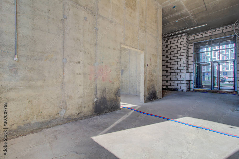 Unfinished construction empty room. Walls from lightweight aggregate ...