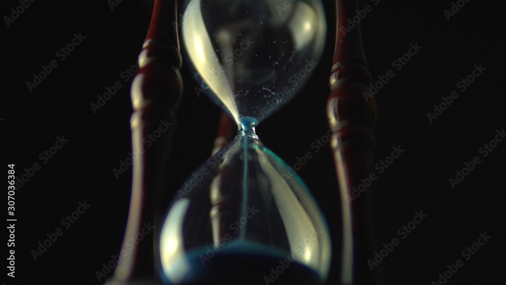 Sand timer clock with sand flowing countdown from through hour glass ...