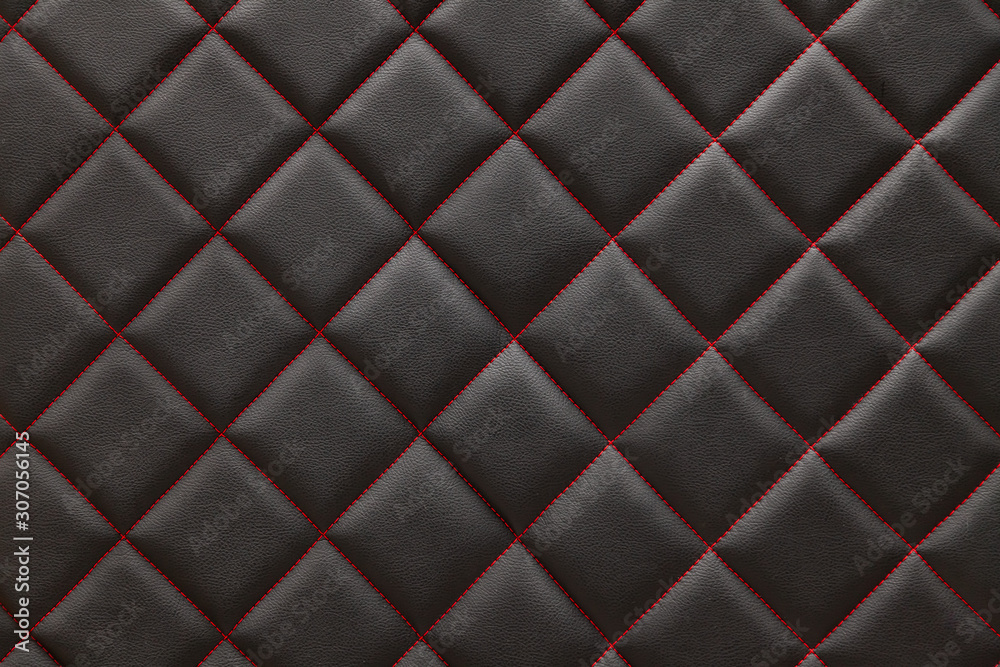 Black leather background and texture stitched with red diamond-shaped ...
