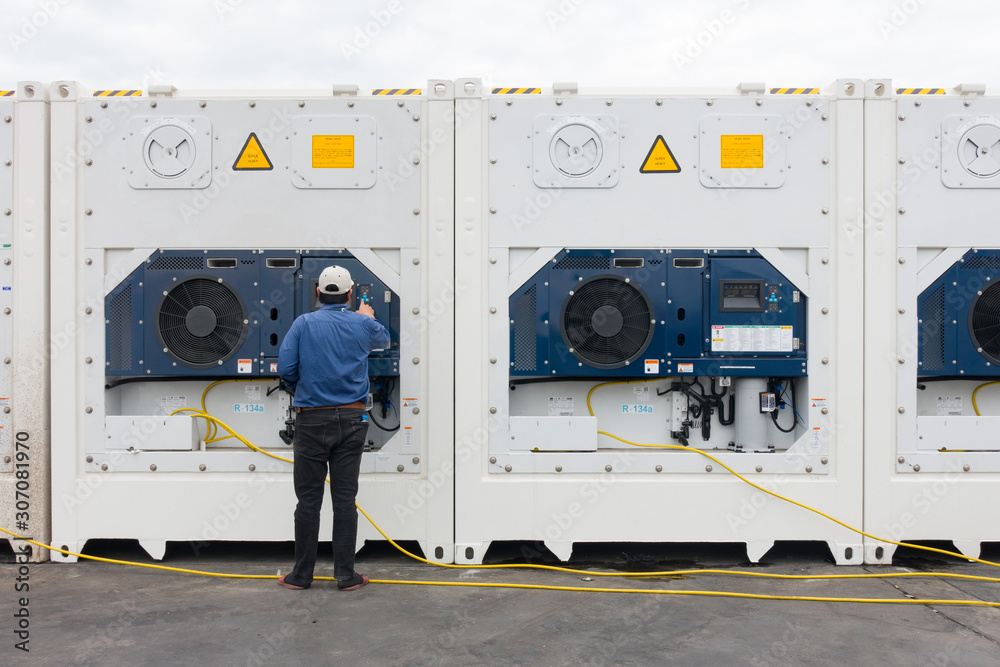 Reefer technician is control the temperature to keep cargo fresh for ...
