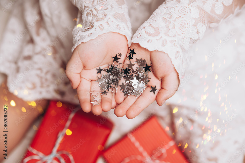 Silver stars sparkling on child's hands and palms. Stock Photo | Adobe ...