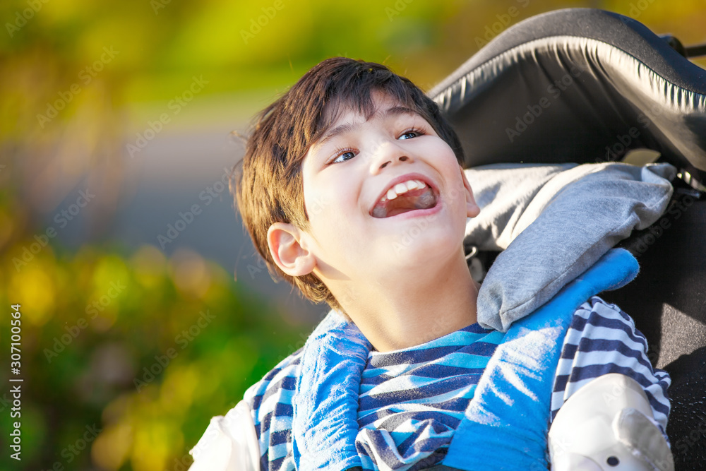 Young disabled boy in wheelchair looking up into sky Stock Photo ...