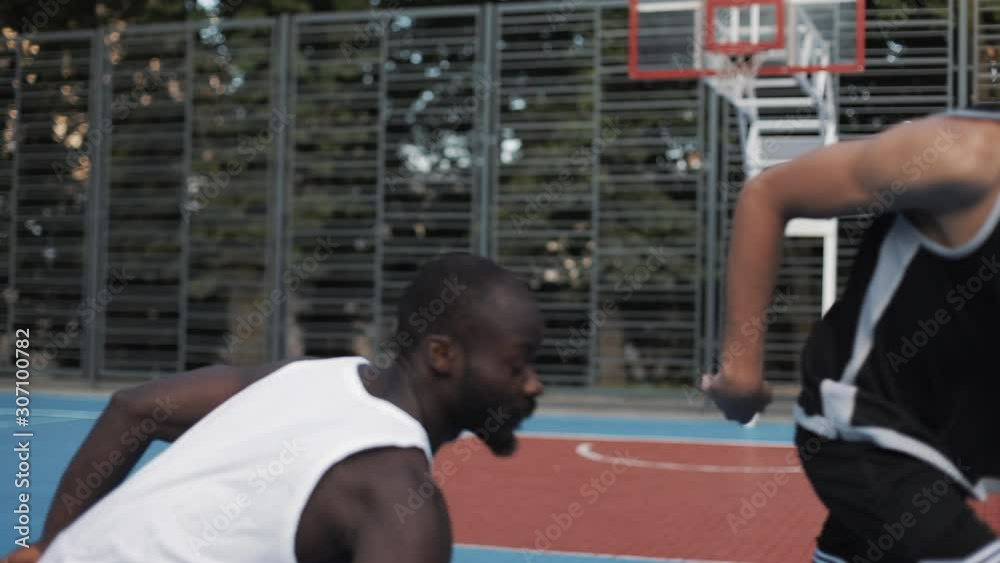 Close Up of Two Young Mixed Race Active Guys Playing Basketball, One on ...