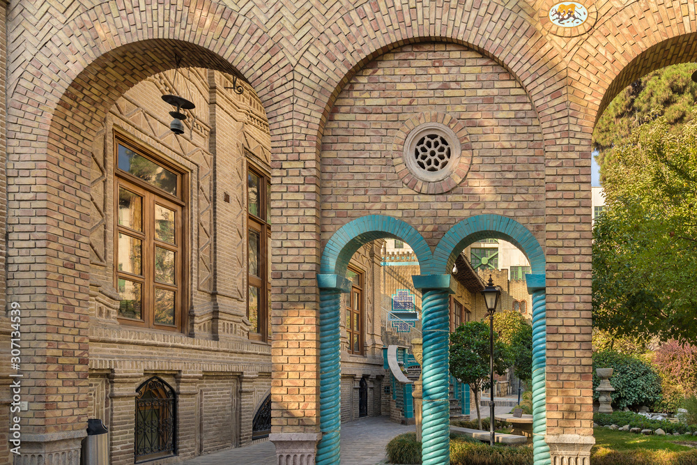 Arch wall that separates two courtyards in Moghadam house museum ...
