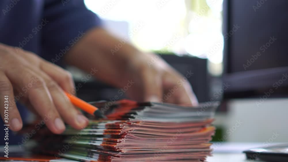 Pile of presentation brochure document concept : Businessman hands ...