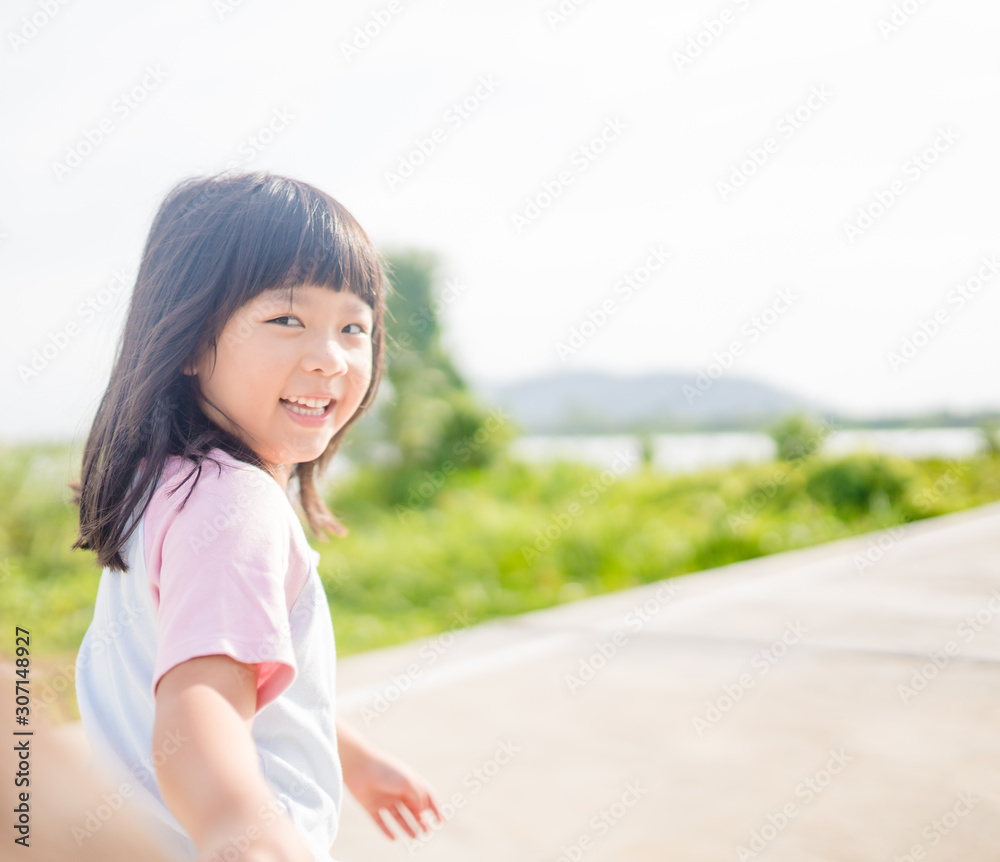 Happy Little asian girl child showing front teeth with big smile ...
