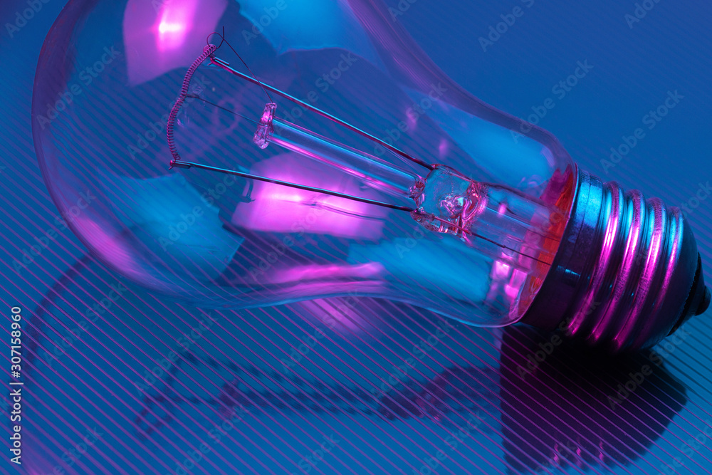 Photo of light bulb lamp in neon light. Ideea concept. Stock Photo ...