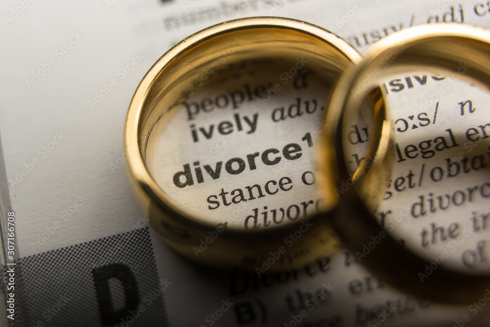 Divorce and separation concept. Two golden wedding rings. Dictionary ...