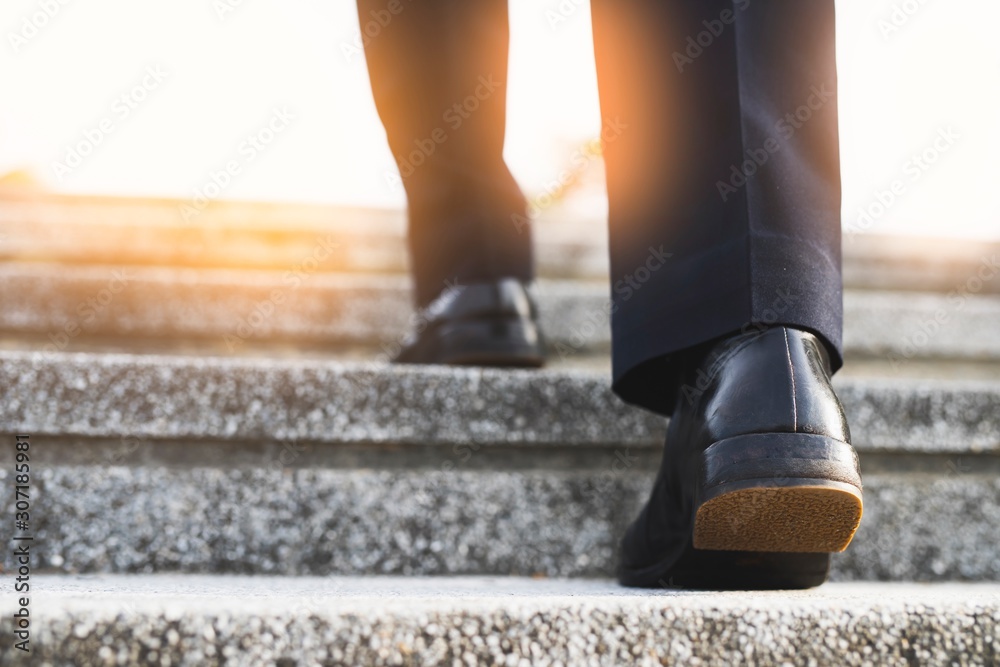 Image of a man walking up the stairs to achieve the goal Stock Photo ...