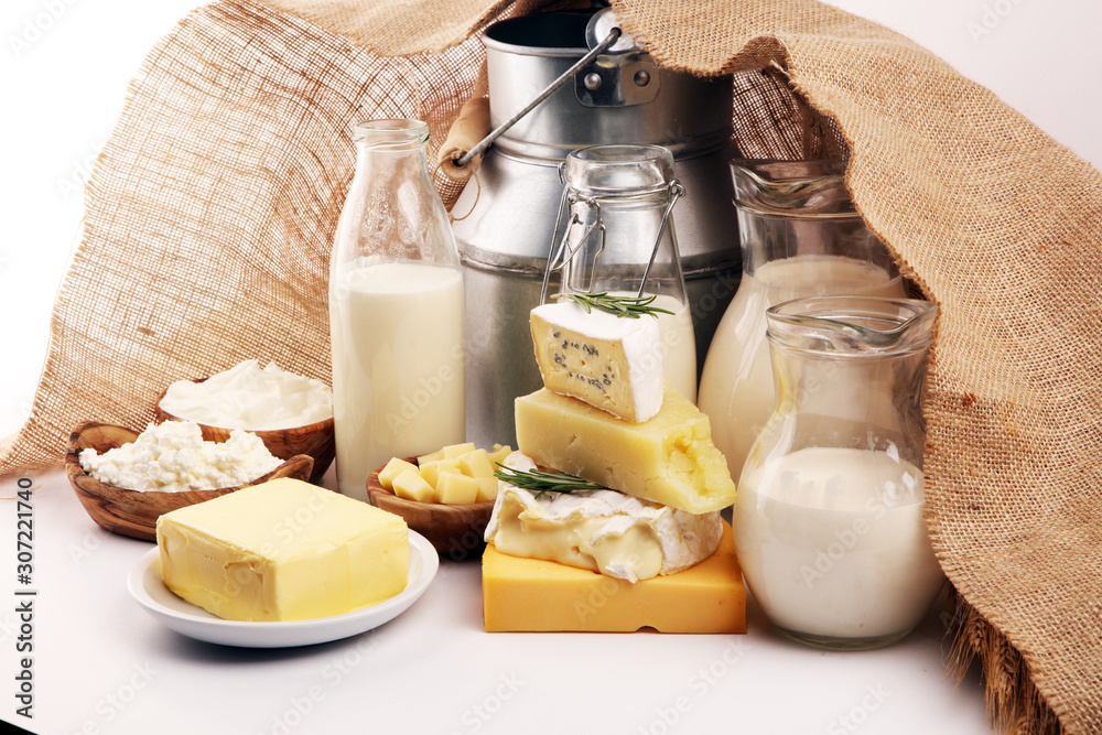 Different healthy dairy products on rustic background with milk, cheese ...