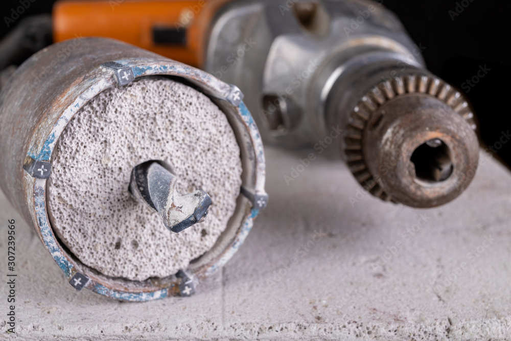 Drilling large diameter holes in concrete with a hole saw. Construction ...