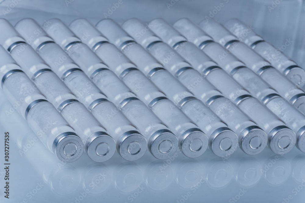 Glass medical ampoule vial for injection. Medicine is dry white drug ...