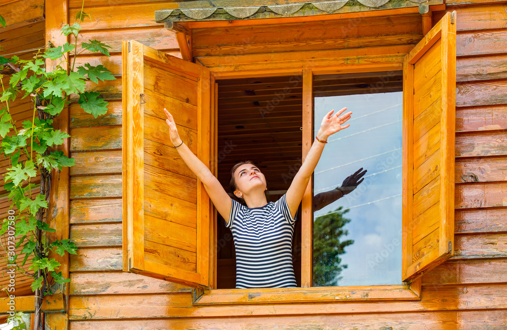 Beautiful little girl watching out of a window - young girl breath of ...