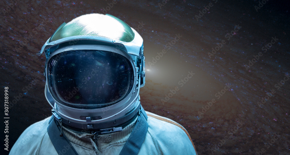 Astronaut in a front of stars in outer space. Conquest of Space Concept ...