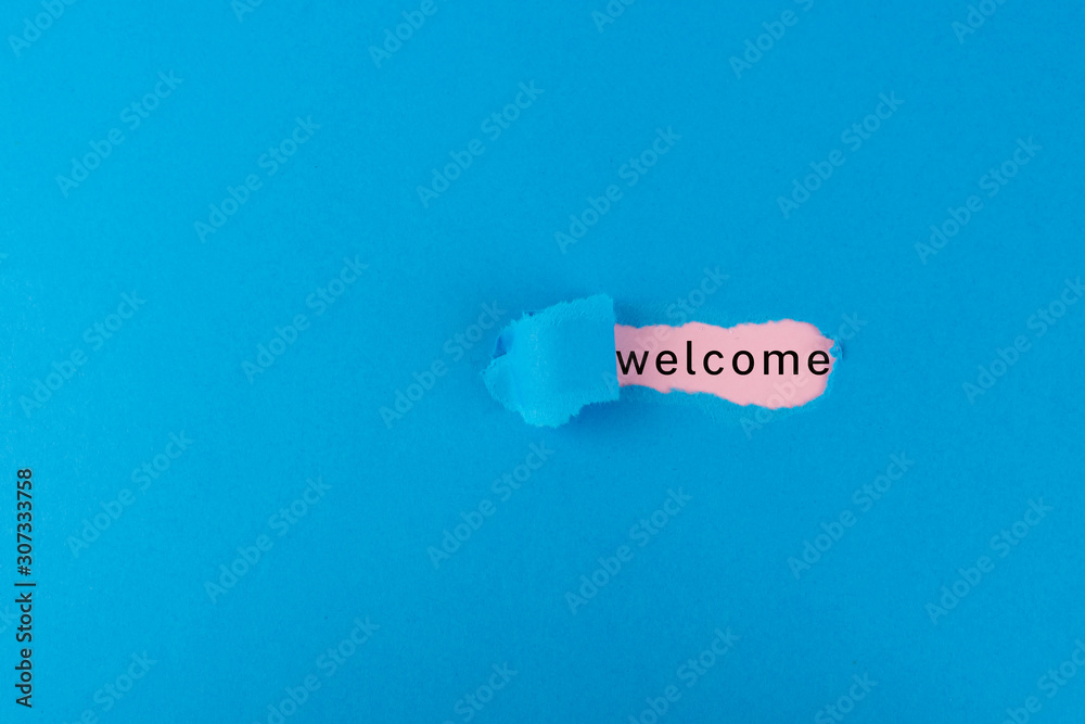 Torn paper with the word welcome underneath Stock Photo | Adobe Stock