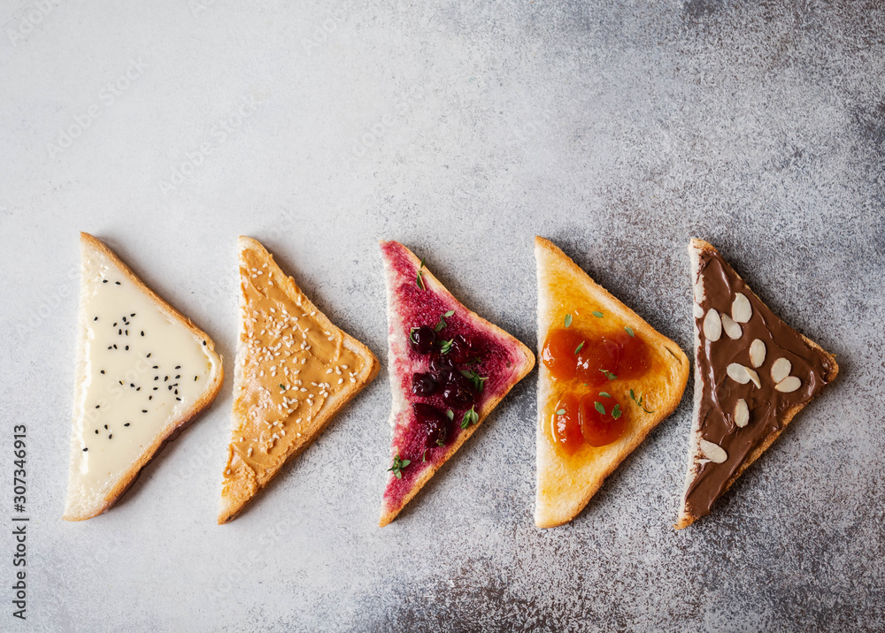 Various sweet toasts with chocolate paste, condensed milk, peanut ...