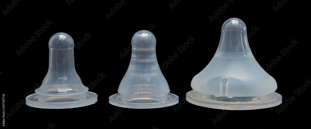 close up Small and large size baby teat with black background, isolated ...