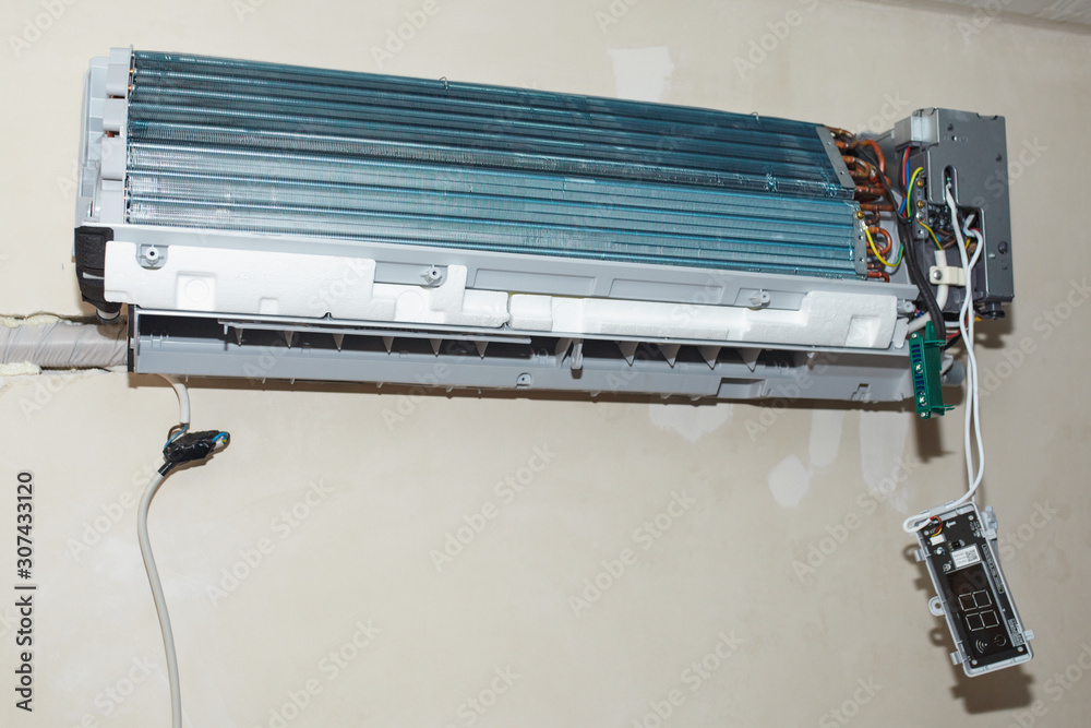 Split air conditioner closeup repair and maintenance concept. The ...