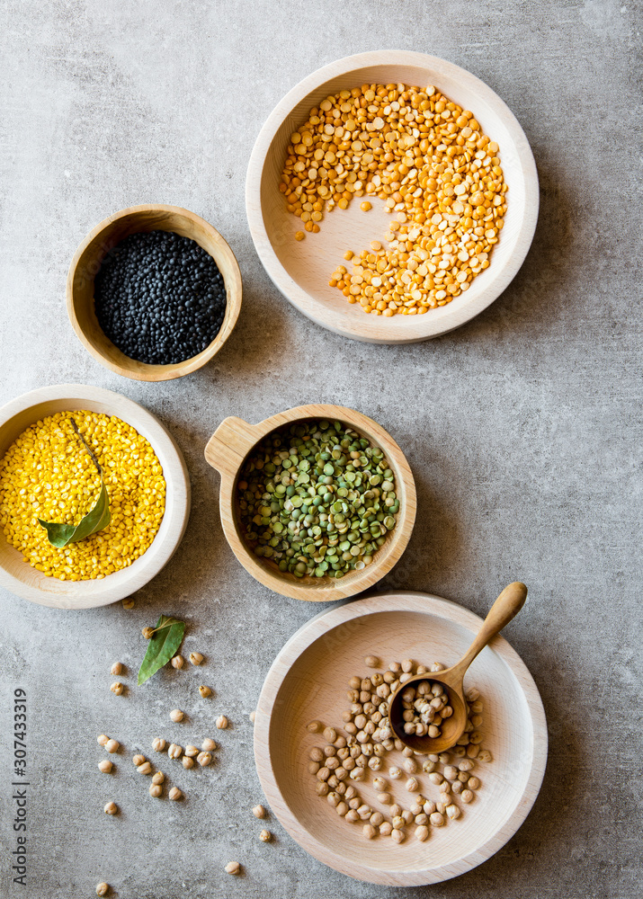 Overhead view of various lentils and beans in wooden bowls Stock Photo ...