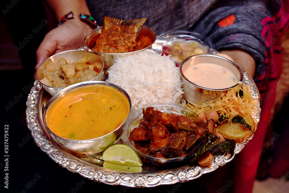 Newly married husband and wife exchanging Traditional Indian food Thali ...