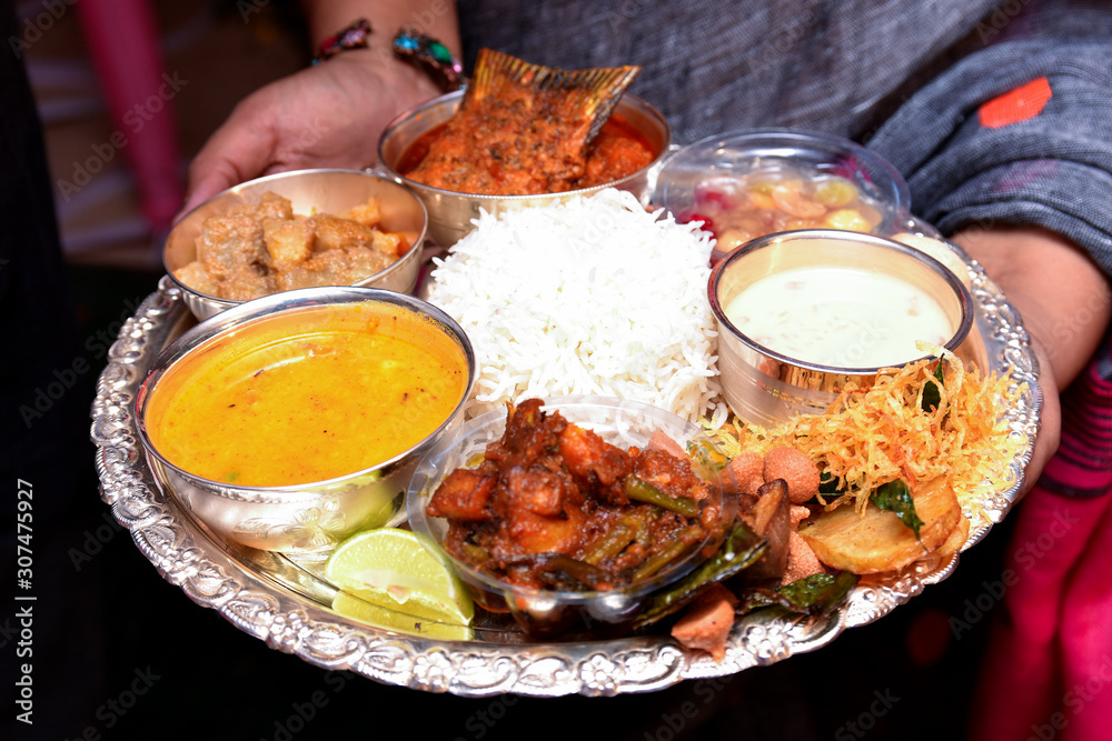 Newly married husband and wife exchanging Traditional Indian food Thali ...