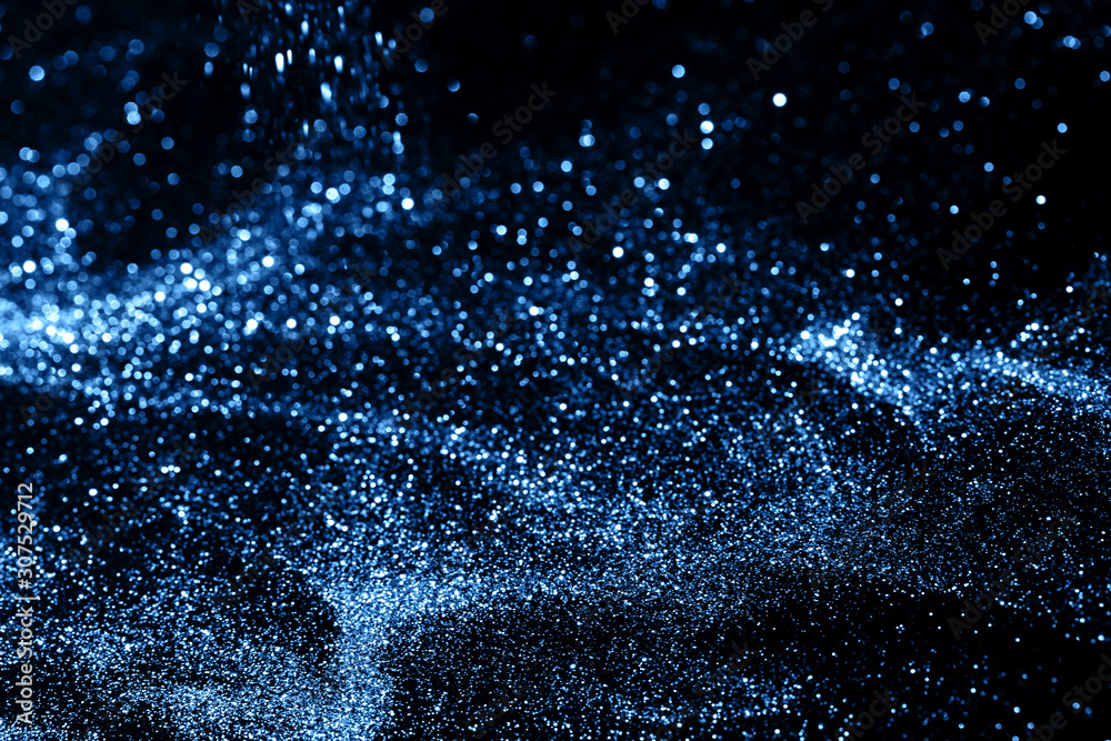 Splash of blue sparkles on black background. Color of the year 2020 ...