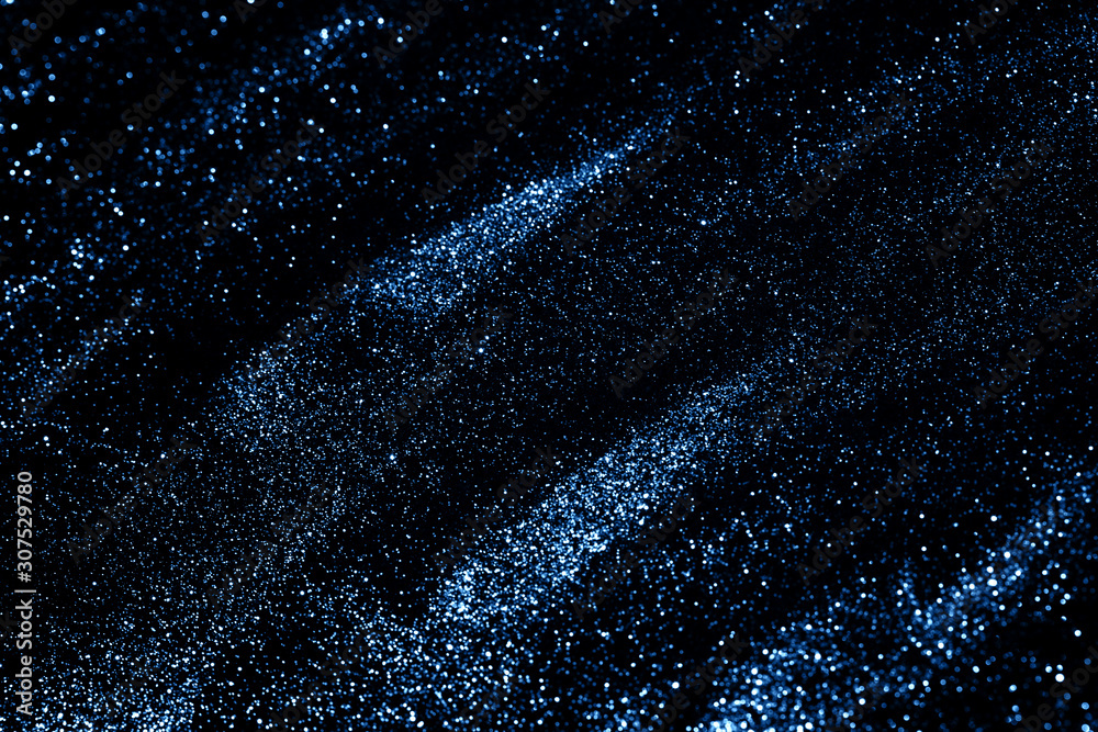 Splash of blue sparkles on black background. Color of the year 2020 ...