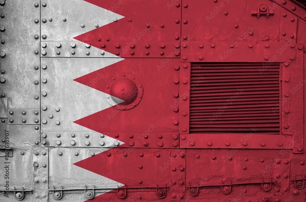 Bahrain flag depicted on side part of military armored tank closeup ...