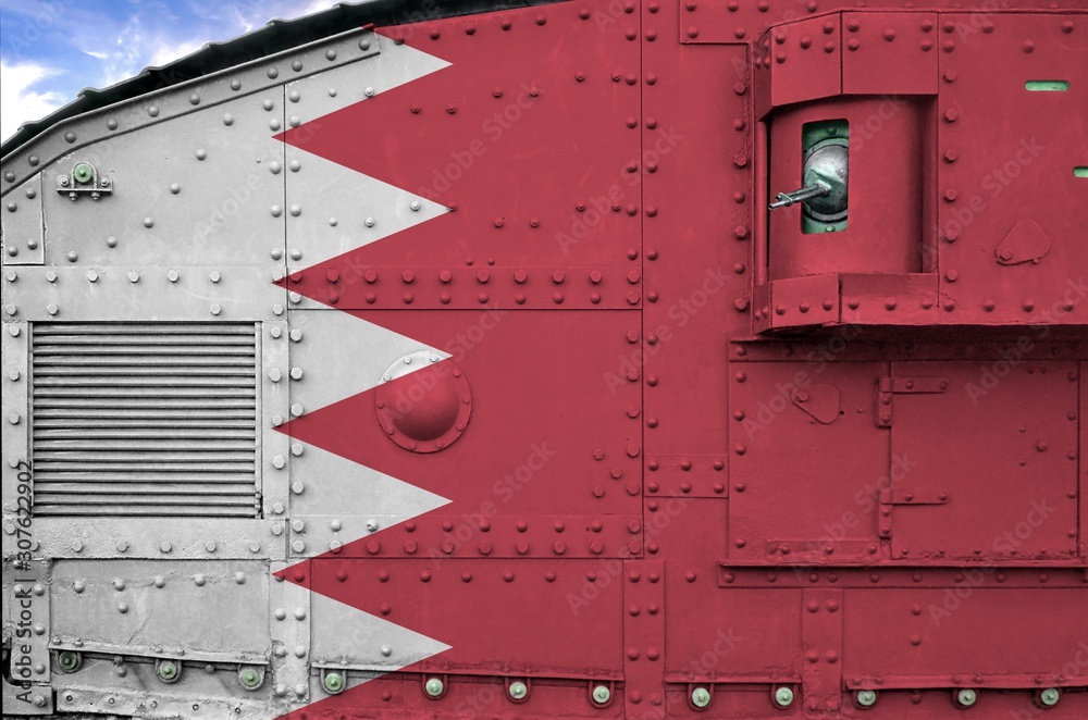 Bahrain flag depicted on side part of military armored tank closeup ...