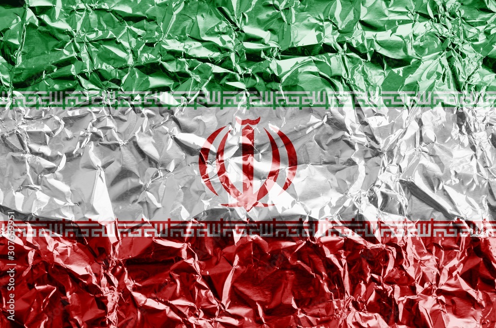 Iran flag depicted in paint colors on shiny crumpled aluminium foil ...