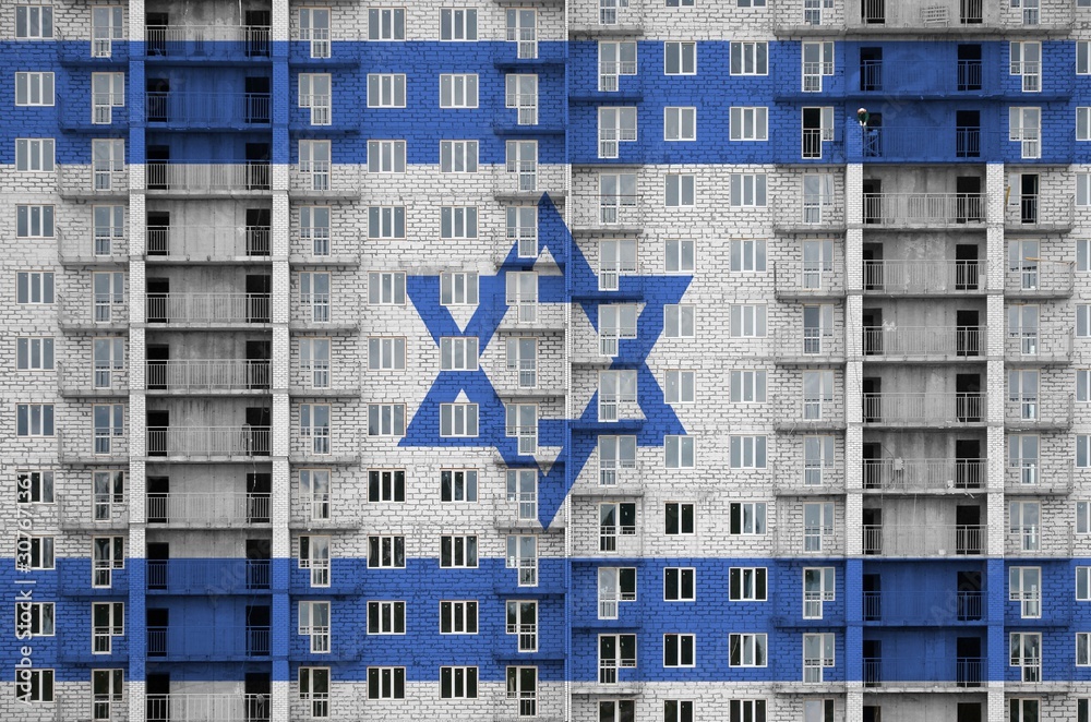 Israel flag depicted in paint colors on multi-storey residental ...