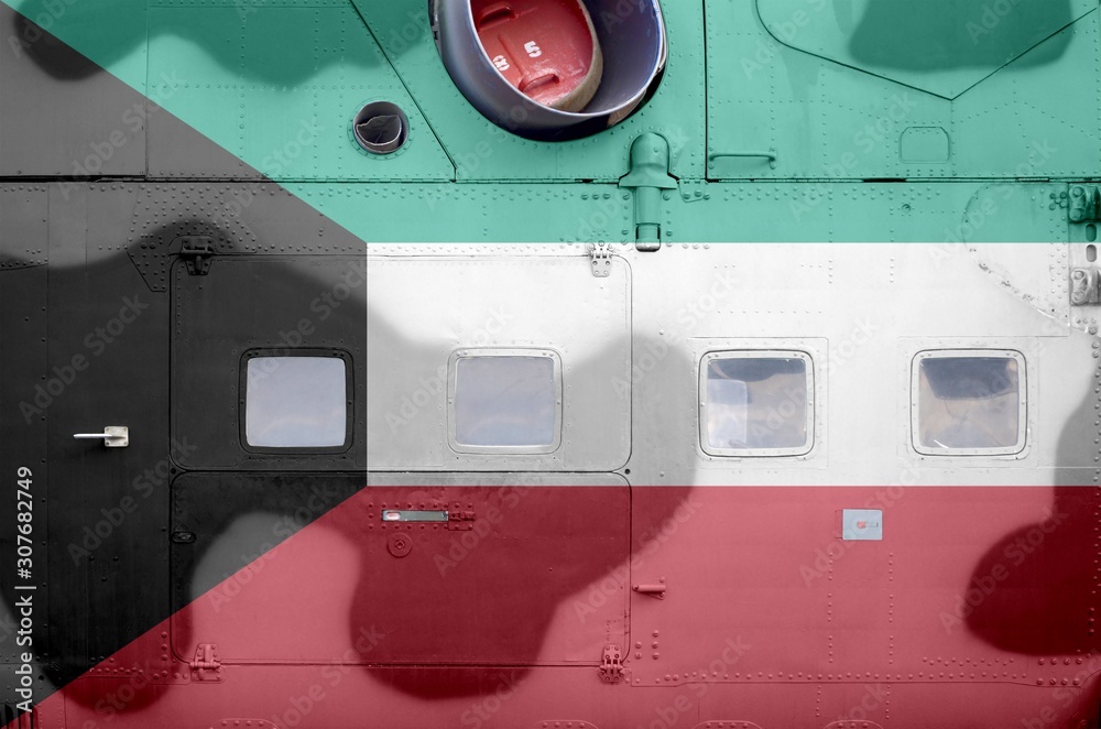 Kuwait flag depicted on side part of military armored helicopter ...