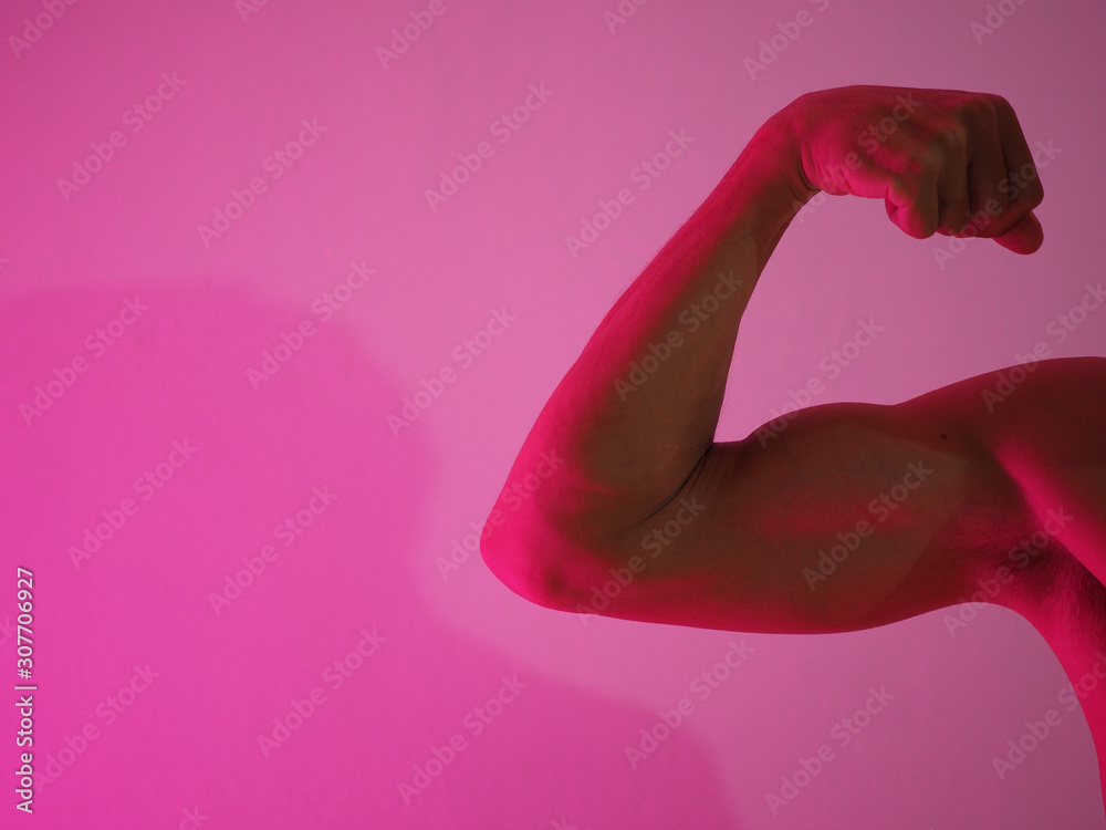 Strong male arm shows biceps. Neon led pink light. Stock Photo | Adobe ...