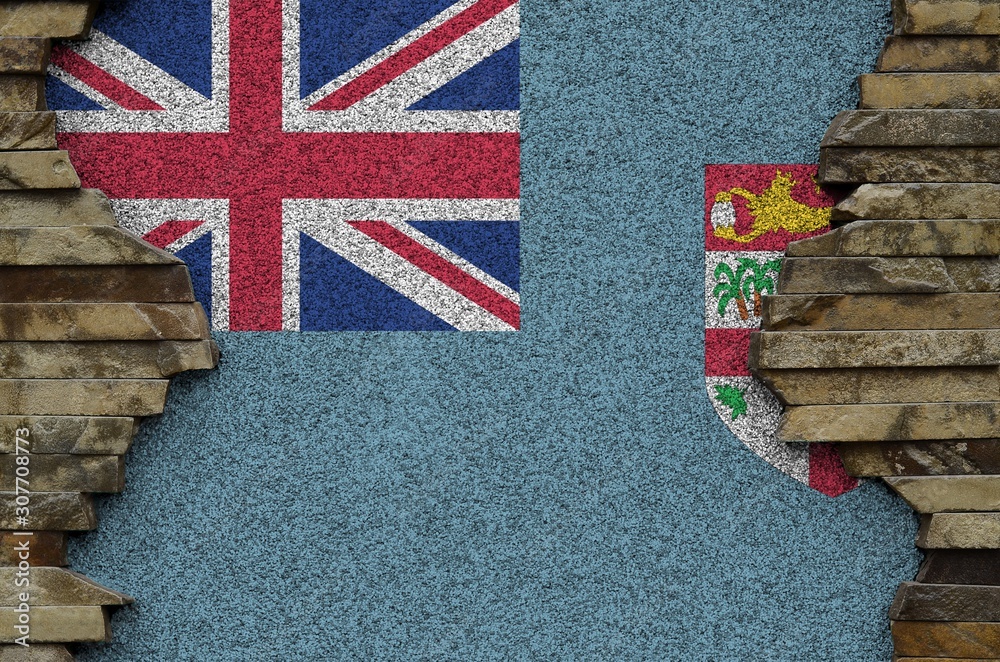 Fiji flag depicted in paint colors on old stone wall closeup. Textured ...