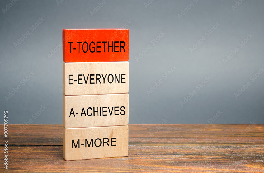Wooden blocks with the word Together, Everyone, Achieves, More ...