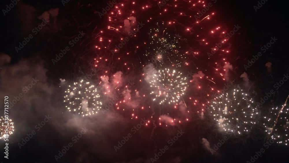 Golden big shiny fireworks with bokeh lights in the night sky. Glowing ...