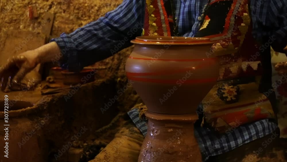Experienced master doing a pot on a pottery wheel, Chez Galip make a ...