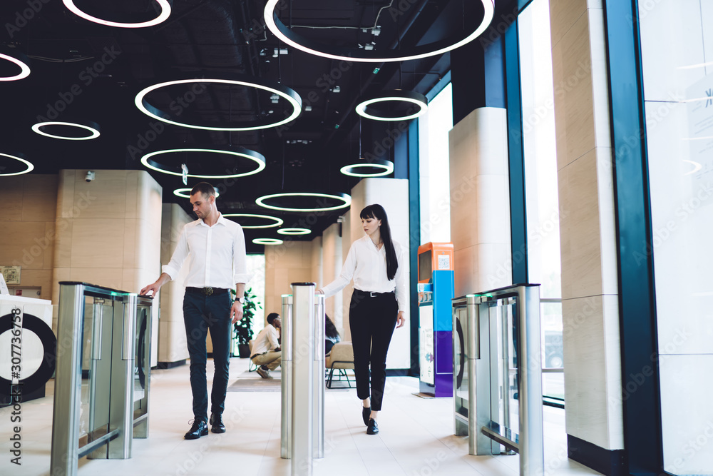 Focused coworkers going through checkpoint at workplace Stock Photo ...