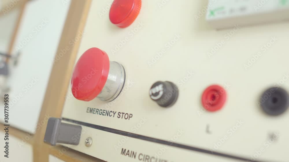 Engineer hand immediately press on red emergency button to stop machine ...