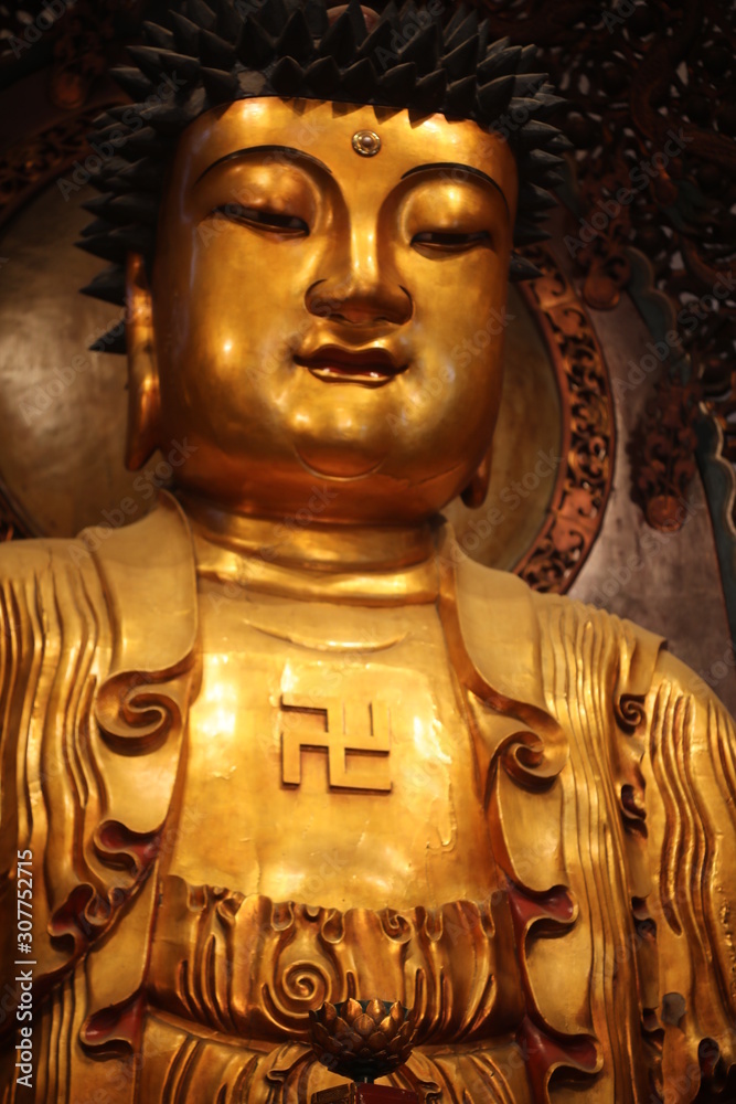 Buddha with the symbol of the swastikaIn. Buddhism, the swastika is ...