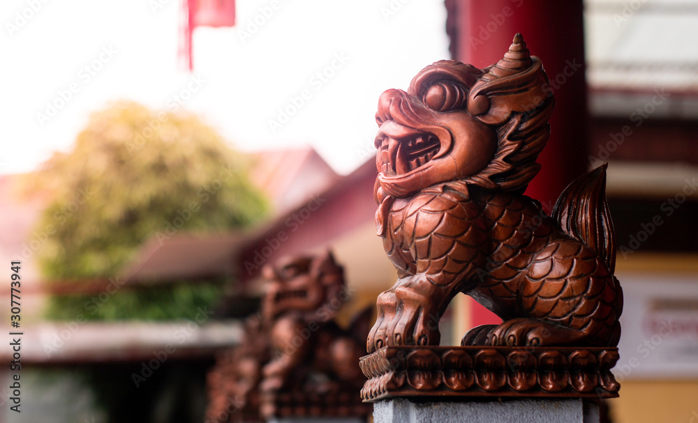 a bronze lion statue in a konghucu temple as a guard symbol Stock Photo ...