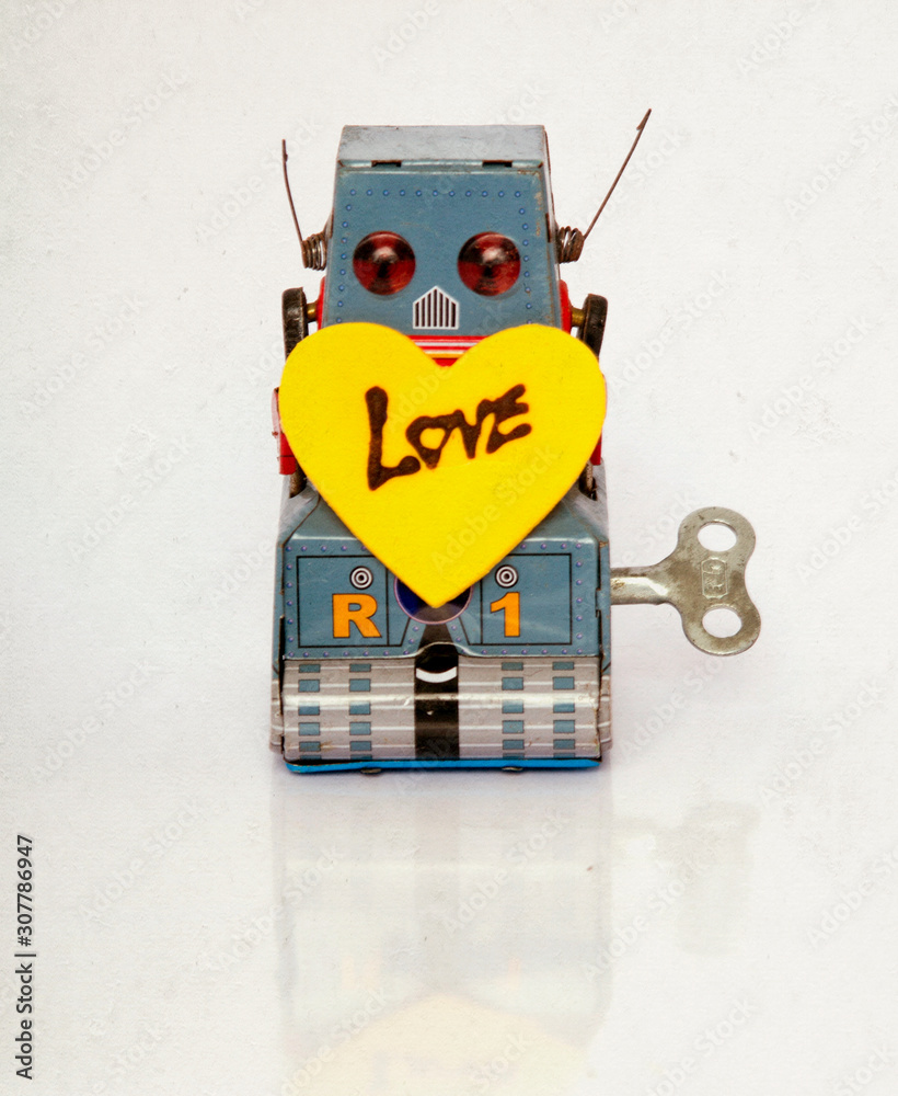 retro tin blue robot toy with a love heart Stock Photo | Adobe Stock