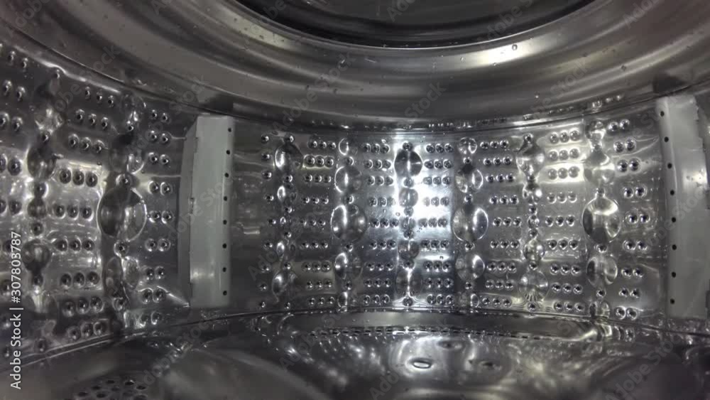Washer, digital camera inside a rotating perforated drum. Internal view ...