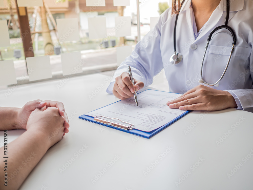 The doctor explained the health examination results to the patient ...