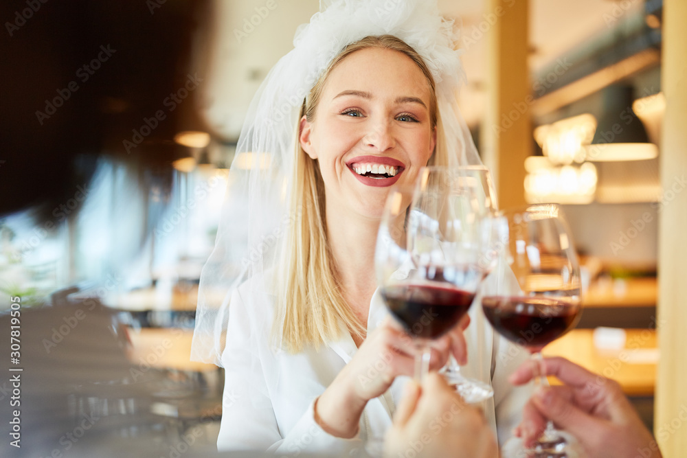 Woman drinking as a laughing bride while drinking wine Stock Photo ...
